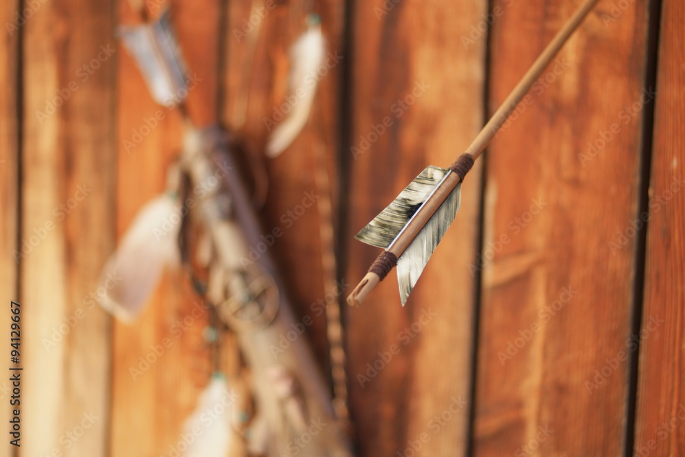 tribal native american bow with feathers Stock Photo | Adobe Stock
