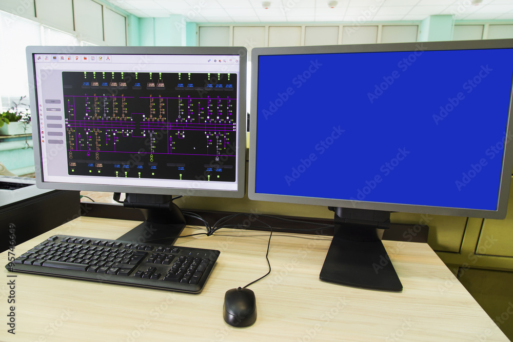 Computers and monitors with schematic diagram for supervisory, control ...