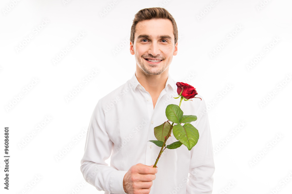 Romantic handsome man holding a red rose Stock Photo | Adobe Stock