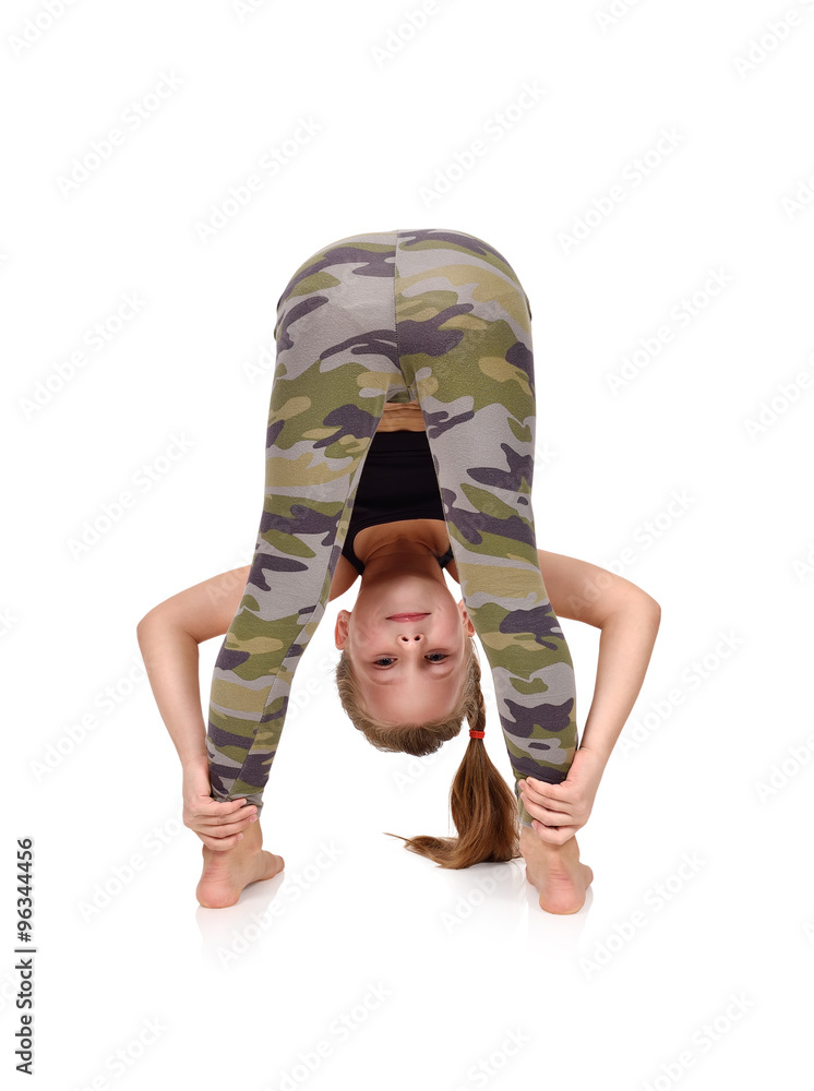 Active little girl doing yoga exercise Stock Photo | Adobe Stock
