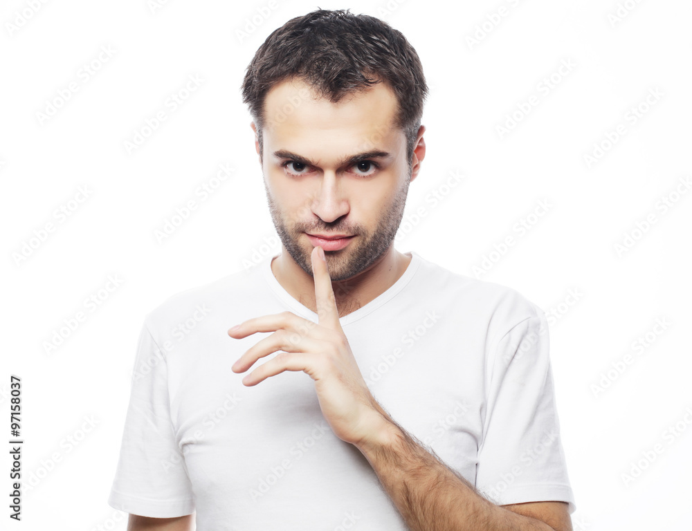 young man making silence gesture, shhhhh!! Stock Photo | Adobe Stock
