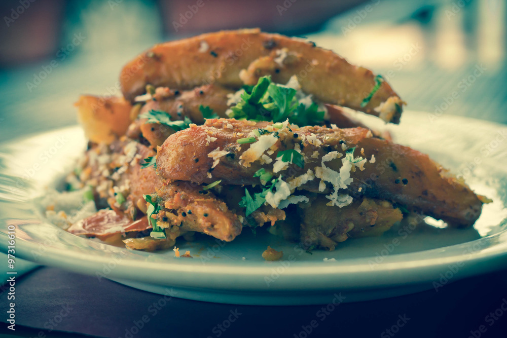 Indian Spiced Potato Wedges Stock Photo | Adobe Stock