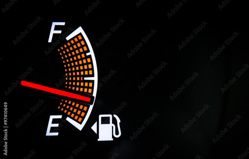Fuel gauge on the black background Stock Photo | Adobe Stock