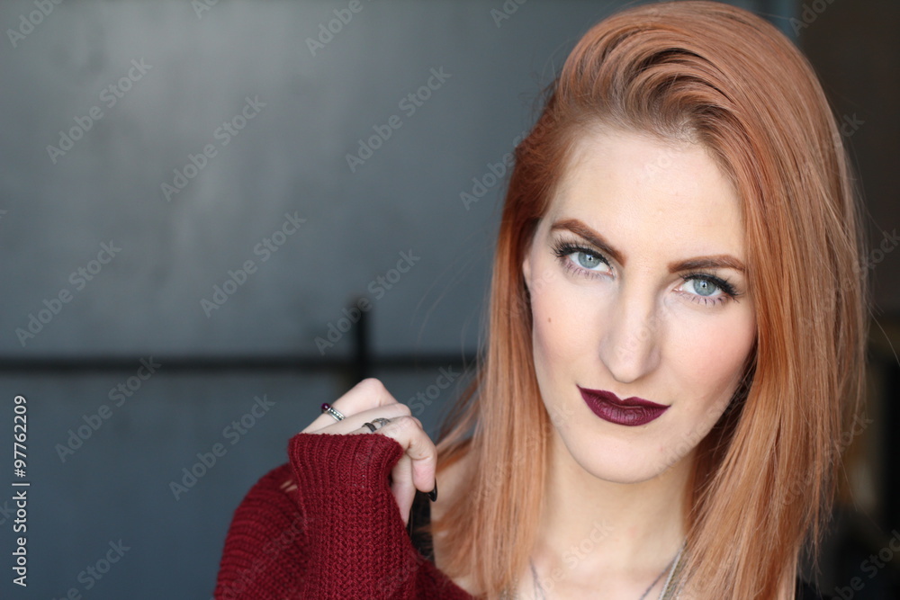 Red-haired girl with intense blue eyes and alternative look Stock Photo ...