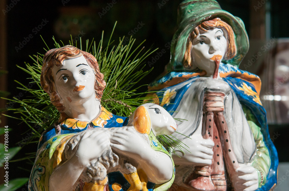 Painted pottery statue portraying a shepherd and his little sheep of a ...
