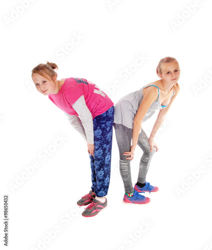 Two sisters standing butt on butt. - Buy this stock photo and explore ...