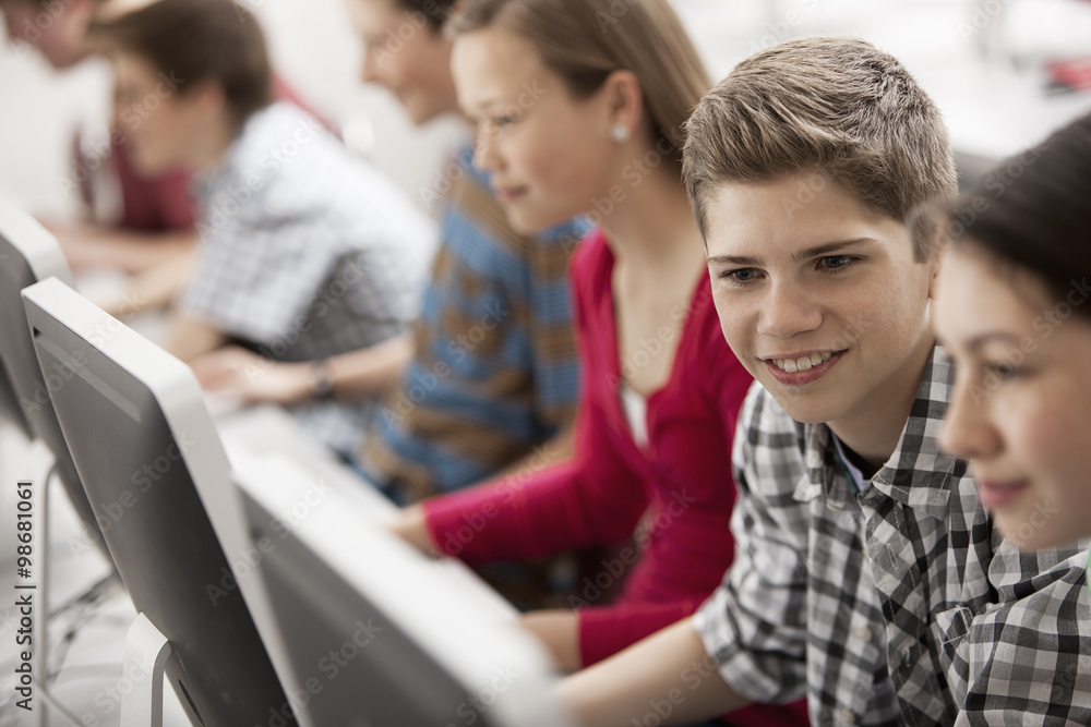 Stock-Foto „A group of young people, boys and girls, working at ...