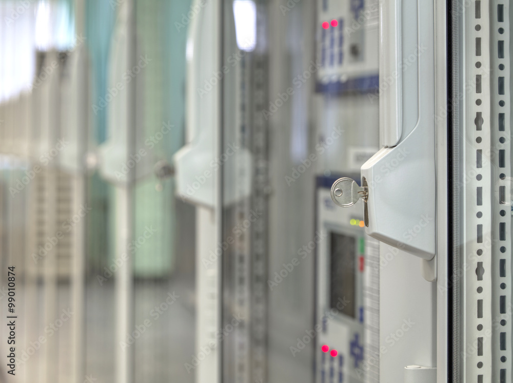 Front glass doors on electrical control cubicles and key in control ...