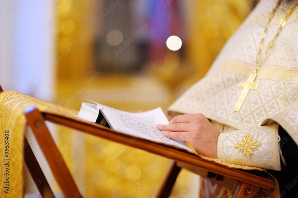 Priest reading church book Stock Photo | Adobe Stock