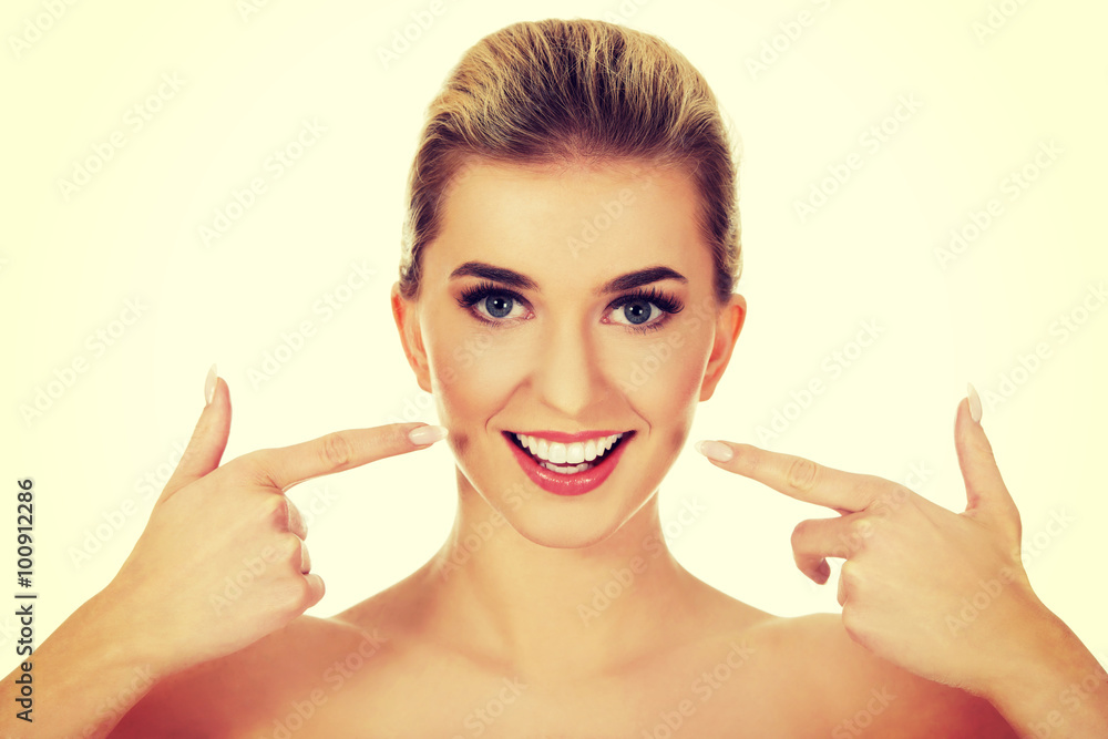Woman showing her white teeth. Stock Photo | Adobe Stock