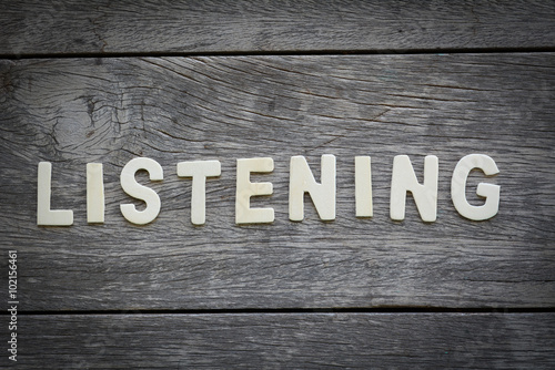 The word listening on the wooden floor - Buy this stock photo and ...