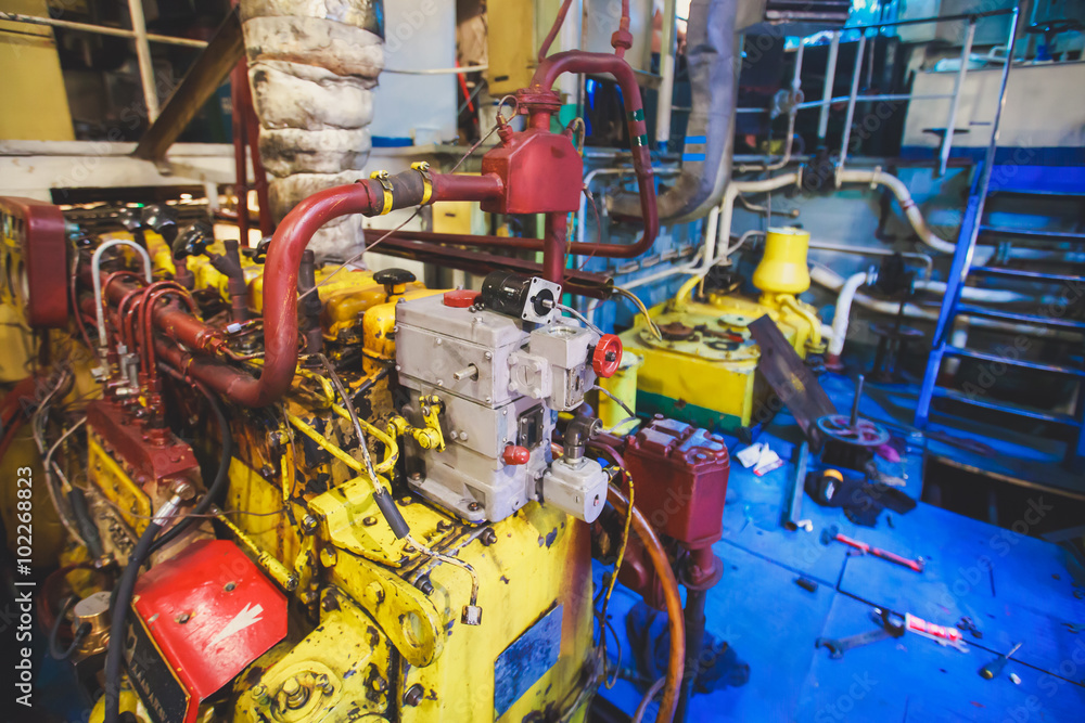 Engine Room on a cargo boat ship interior, ship's engine heavy ...