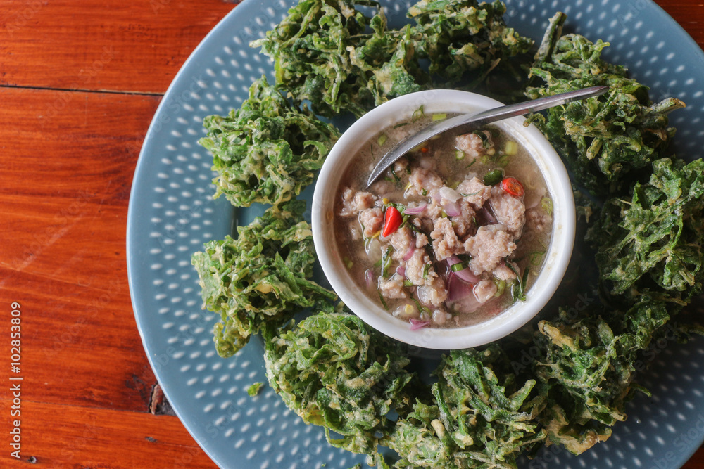 Top view of vegetable fritters serve with spicy minced pork sala Stock ...