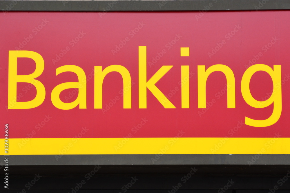 Bank sign shows where to invest your hard earned money. Stock Photo ...