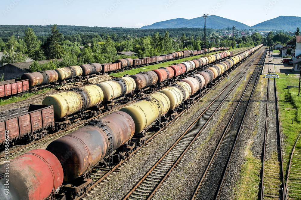 Freight trains.Railroad train of tanker cars transporting crude oil on ...