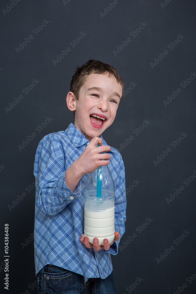 Cheerful smiling boy drinking milk Stock Photo | Adobe Stock
