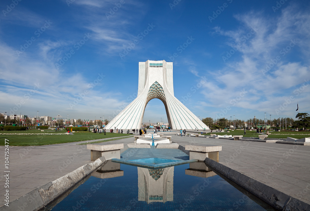 Azadi monument and its reflection on waterways in Azadi square of ...