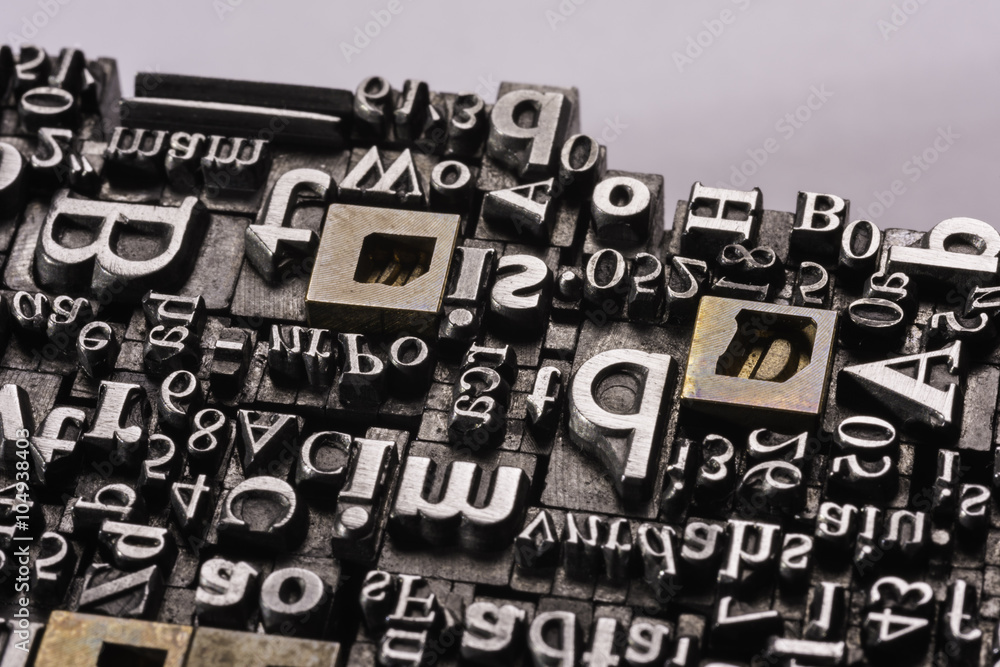 Metal Letterpress Types. A background from many historic typographical ...