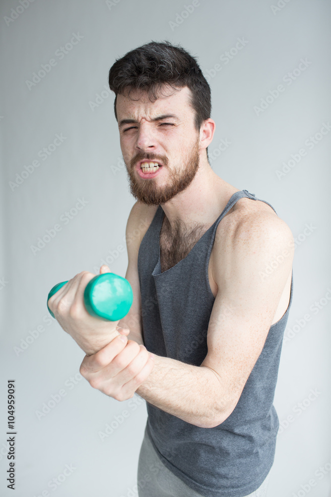 Skinny man training his bicep muscle. Guy lifting one dumbbell. young ...
