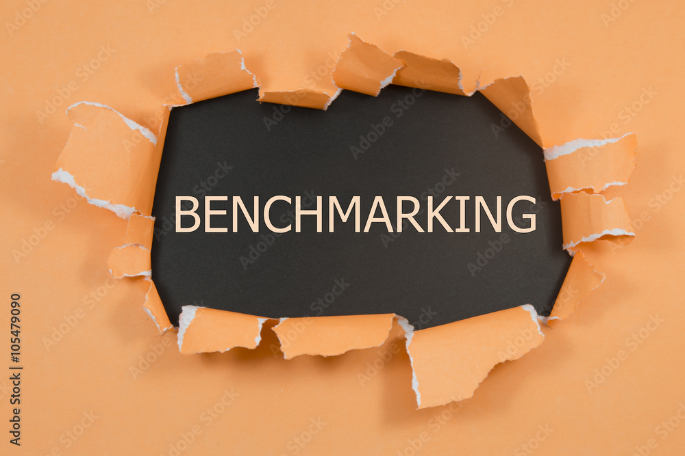 Benchmarking word written under torn paper Stock Photo | Adobe Stock