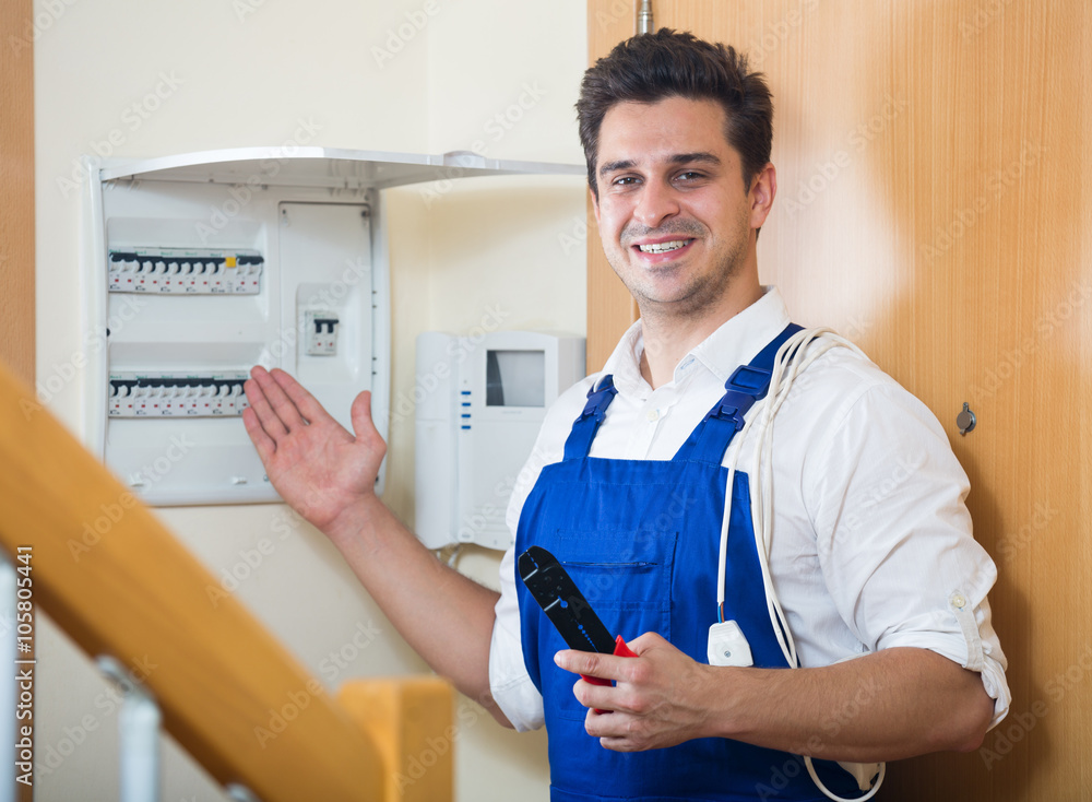 Electrician checking electric automatic control panel at home Stock ...