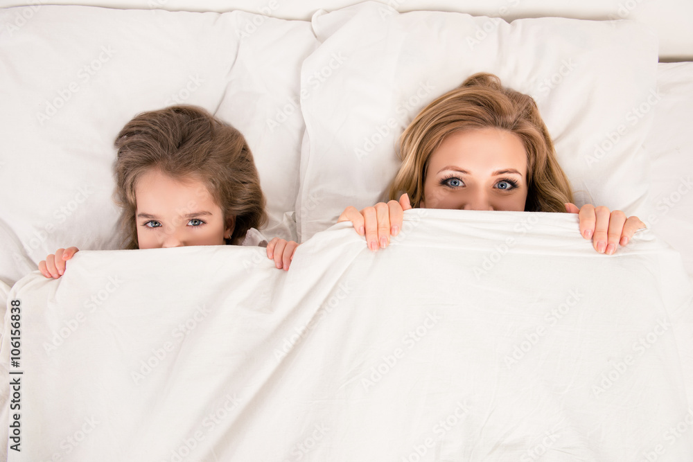 Top view of comic woman and her daughter hiding faces behind bla Stock ...