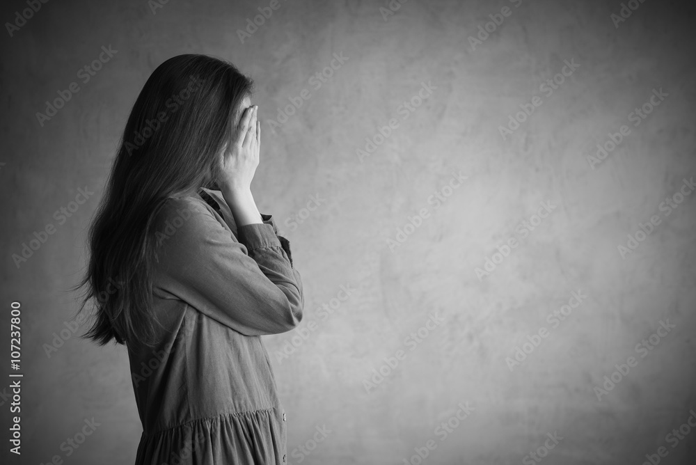 Sad woman covering her face Stock Photo | Adobe Stock