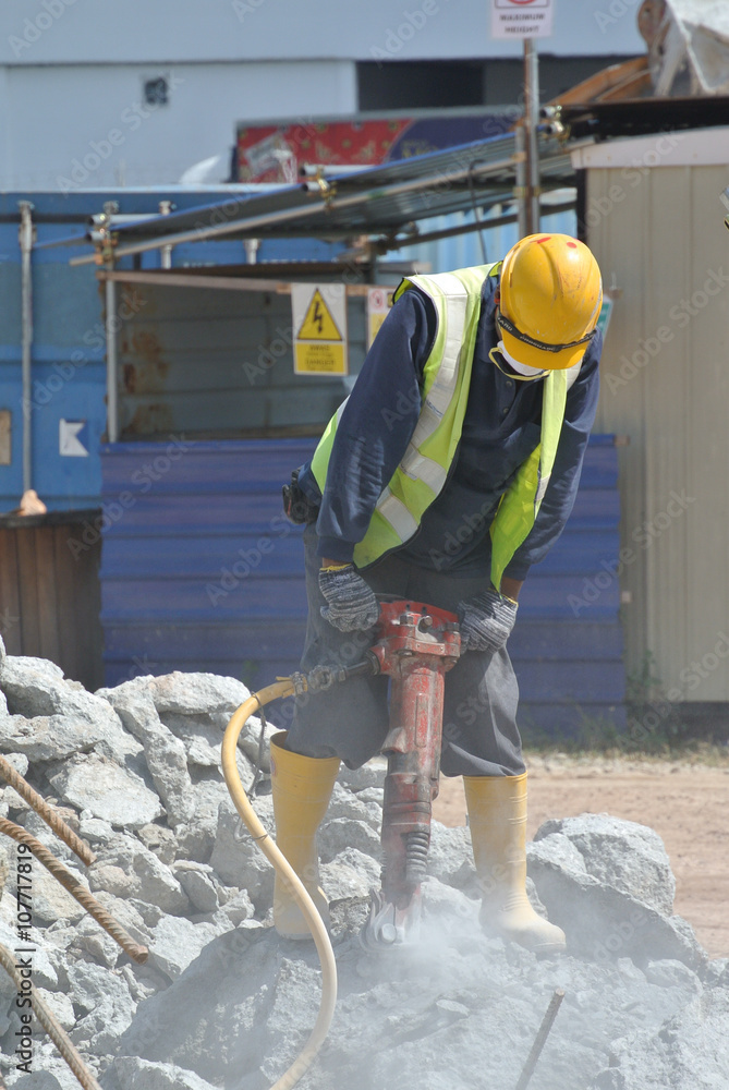 A construction workers cutting foundation pile using hacking method at ...