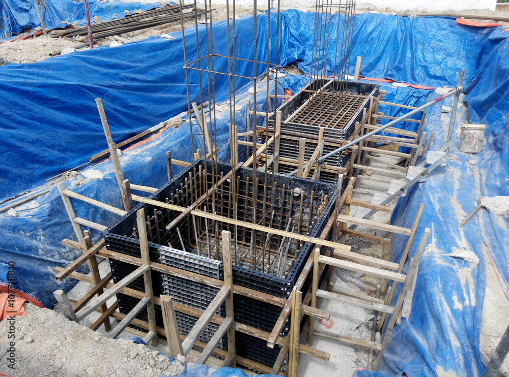 Pile cap formwork with reinforcement bar in it and the excavated pile ...
