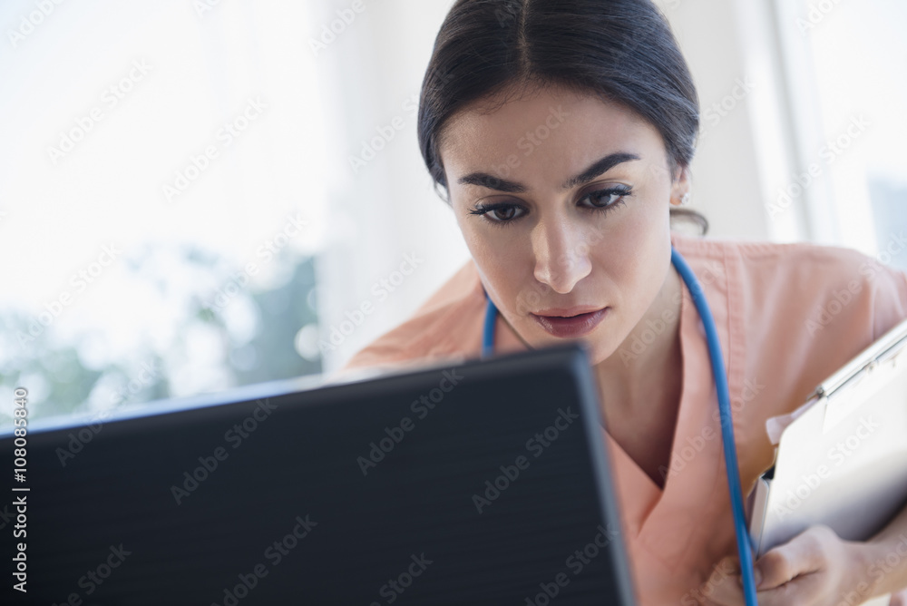 Nurse using computer in hospital Stock Photo | Adobe Stock