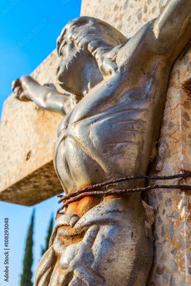 Jesus tied to a cross in graveyard Stock Photo | Adobe Stock