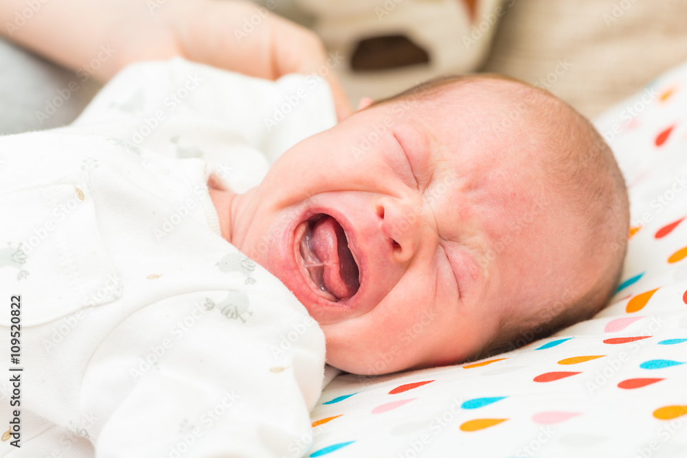 Newborn baby screaming in pain with colic Stock Photo | Adobe Stock