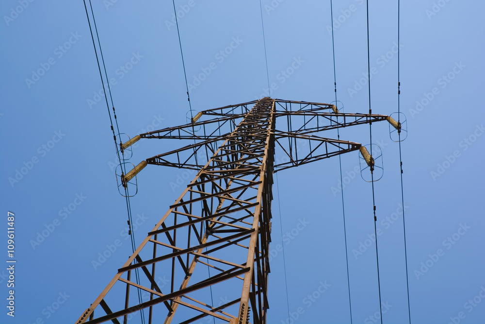 Old rusty electrical power transmission line tower 330 kV on blu Stock ...