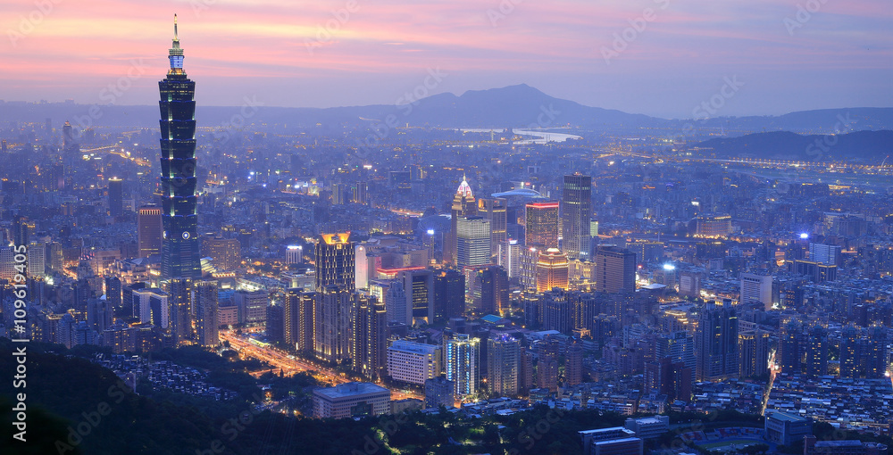 Aerial panorama of busy Taipei City at dusk, with a view of Taipei 101 ...
