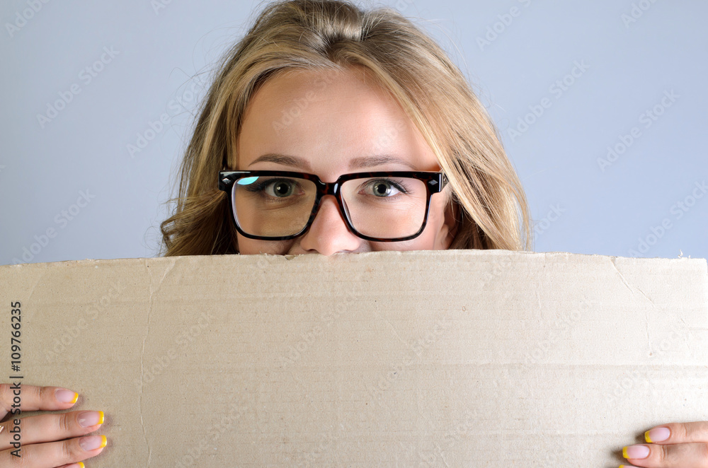 Banner sign woman peeking over edge of blank empty paper billboard ...