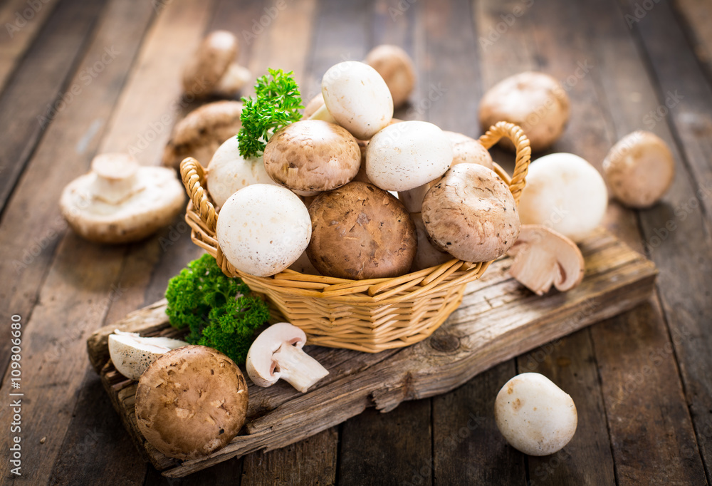 Champignon mushroom on the wooden table Stock Photo | Adobe Stock