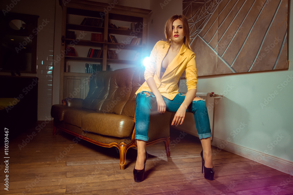 sexy woman in yellow unbuttoned jacket Stock Photo | Adobe Stock