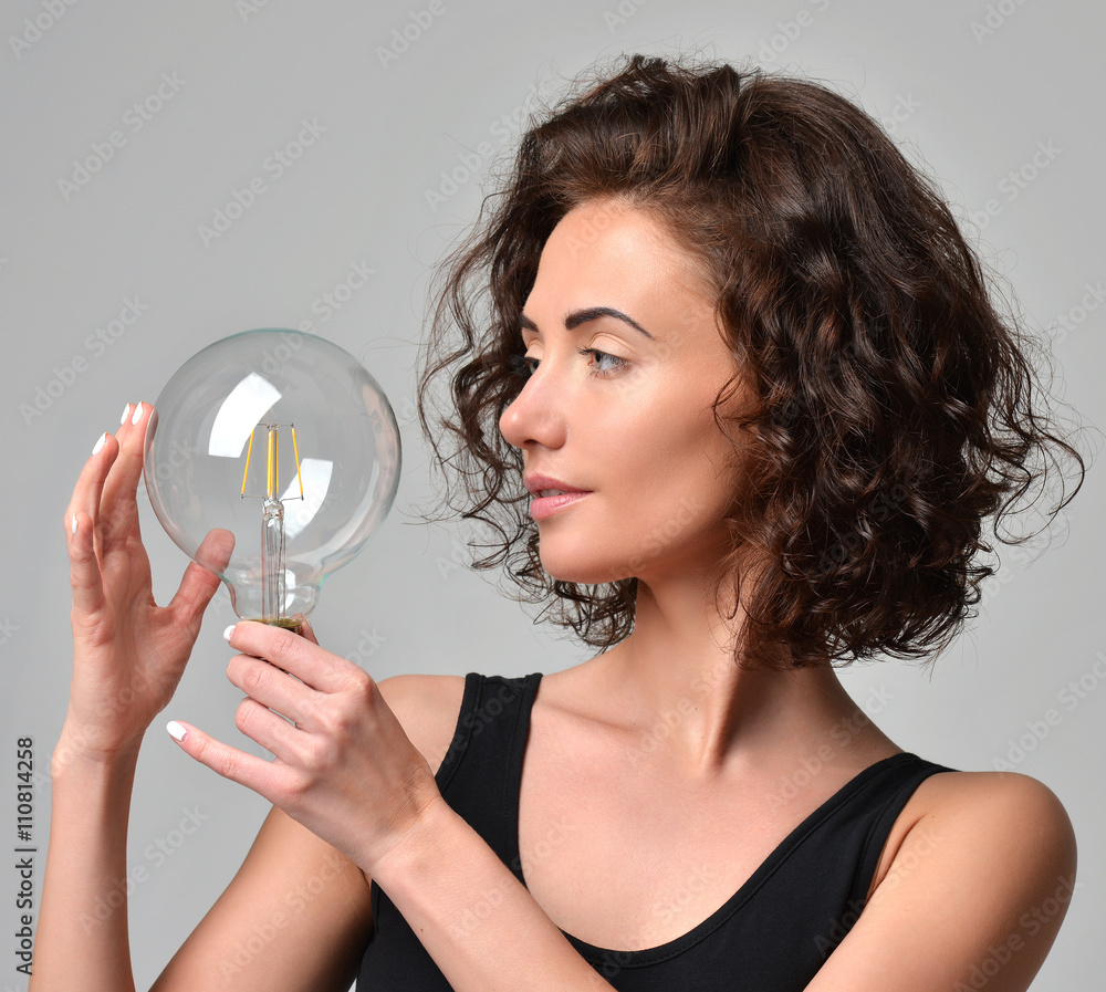 Young curly hair woman with new big e27 LED light bulb Stock Photo ...