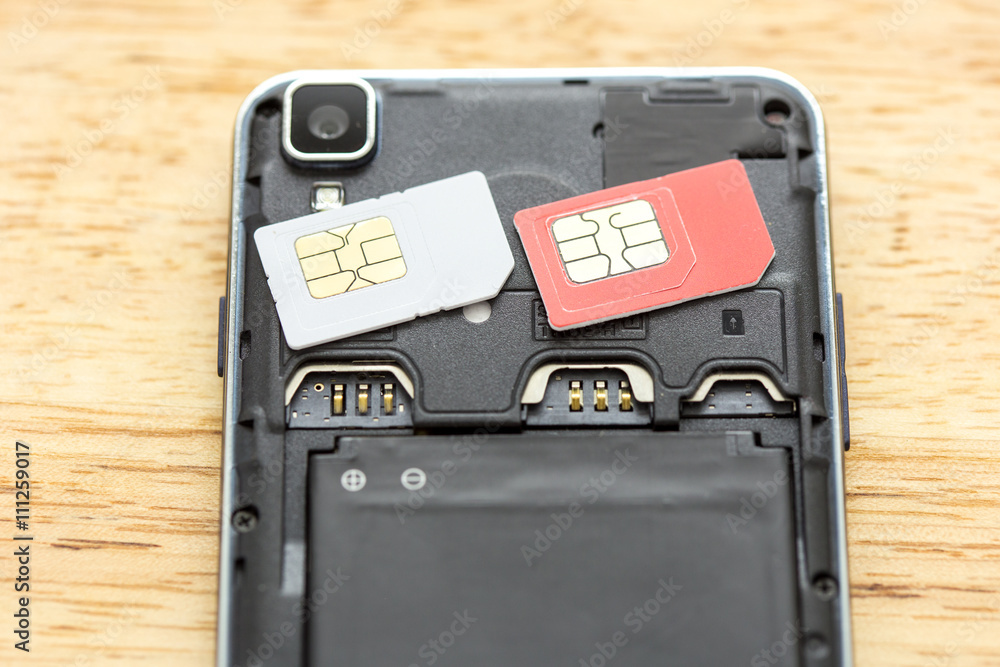 Foto de Stock SIM card on the smart phone | Adobe Stock