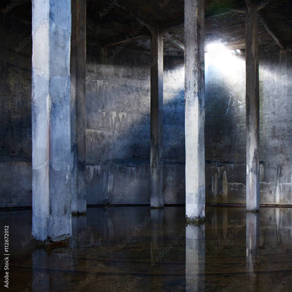 Supporting columns inside disused water tank Stock Photo | Adobe Stock