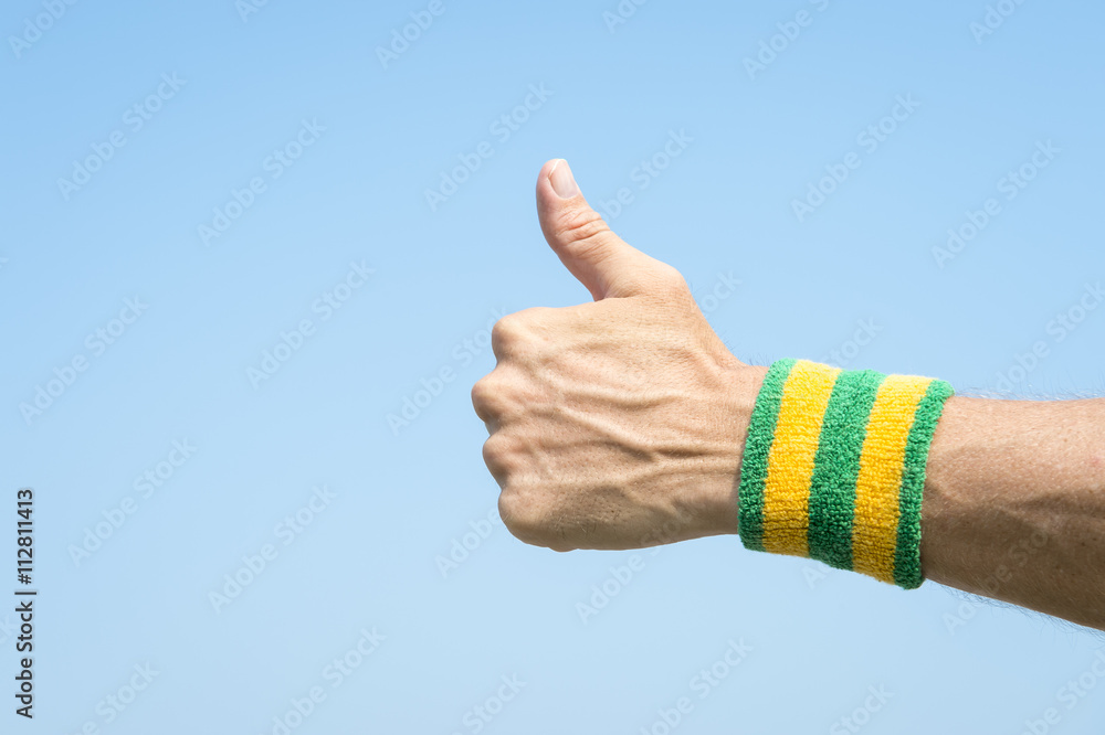 Brazilian athlete wearing Brazil colors green and yellow wristband ...