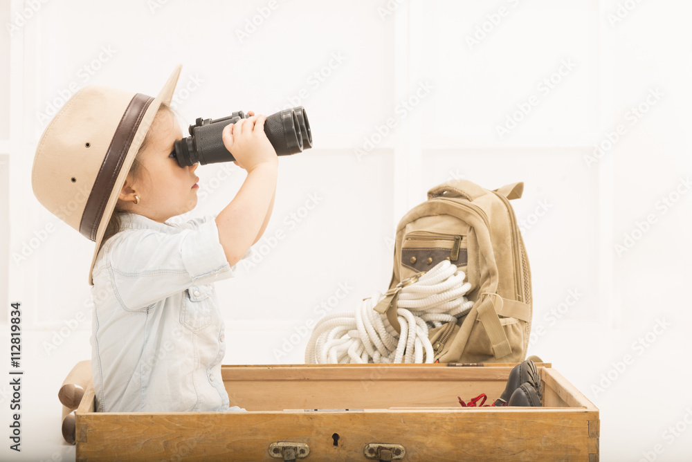 Adorable little explorer girl in a safari hat and explorer clothes with ...