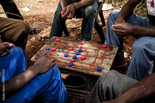 Group of men sitting outdoors, playing Morabaraba in South Africa - Buy ...