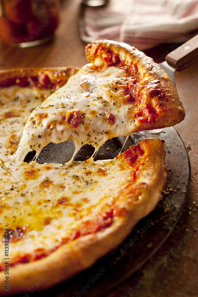 Slice of freshly cooked pizza Stock Photo | Adobe Stock