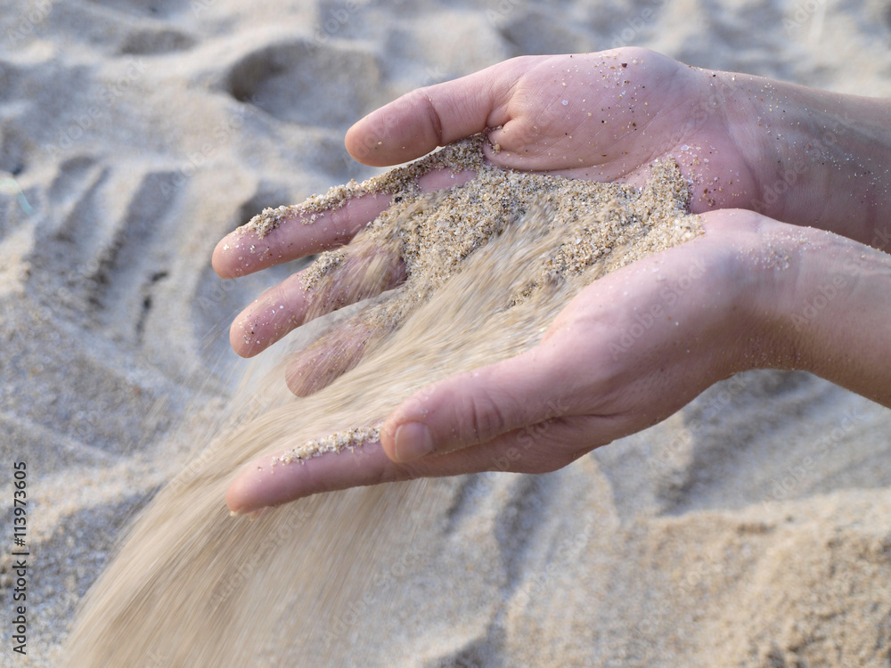 Sand falling from hands Stock Photo | Adobe Stock