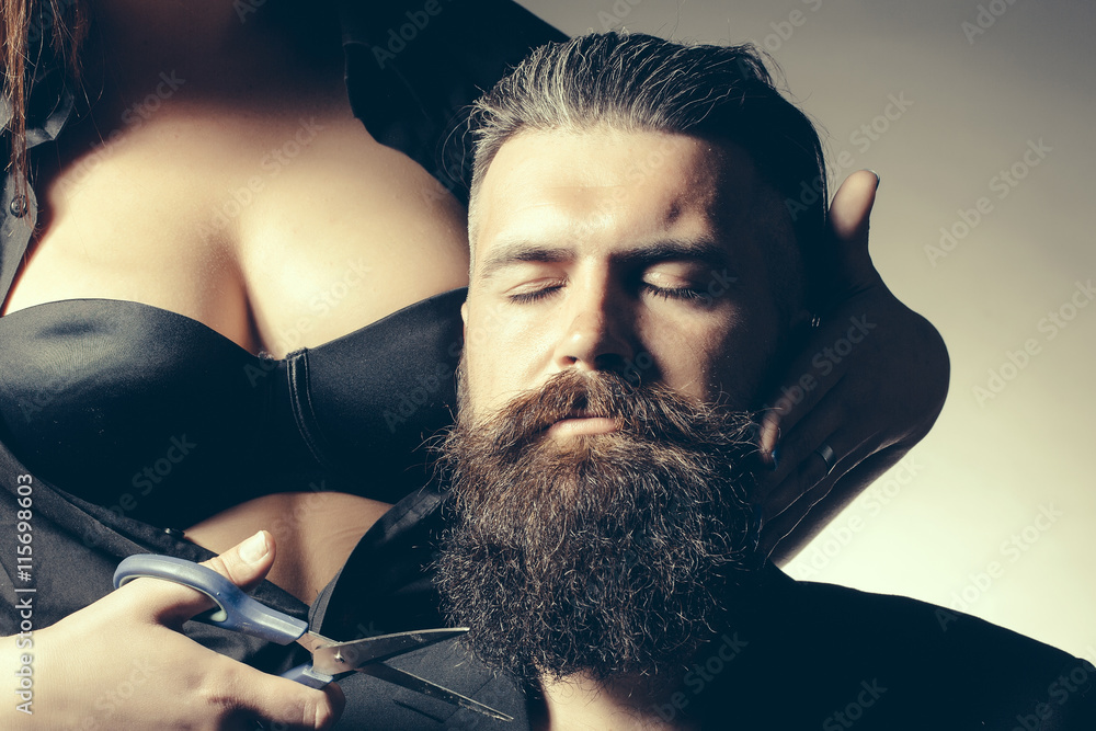 sexy woman cutting male beard Stock Photo | Adobe Stock