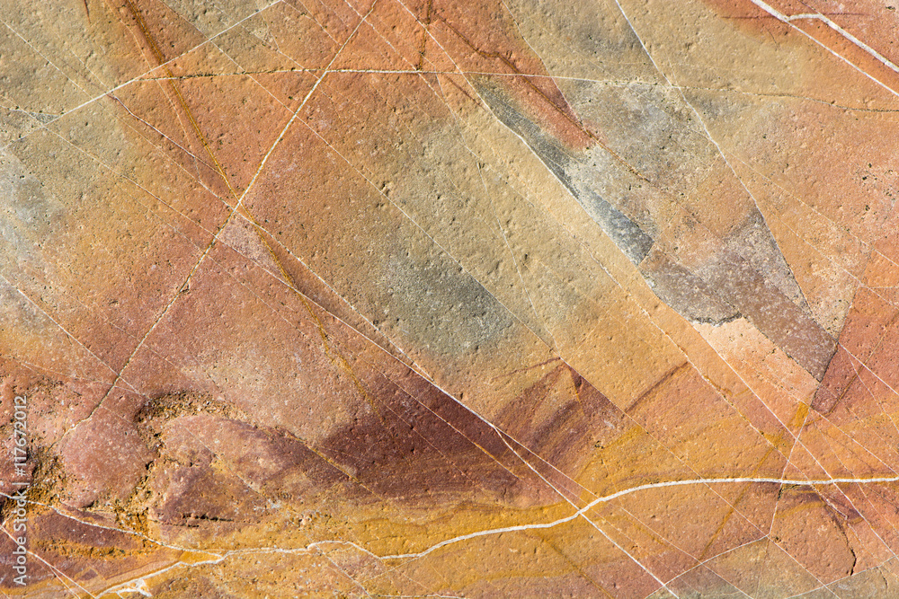 Colourful sedimentary rock background. Cracks and geological features ...