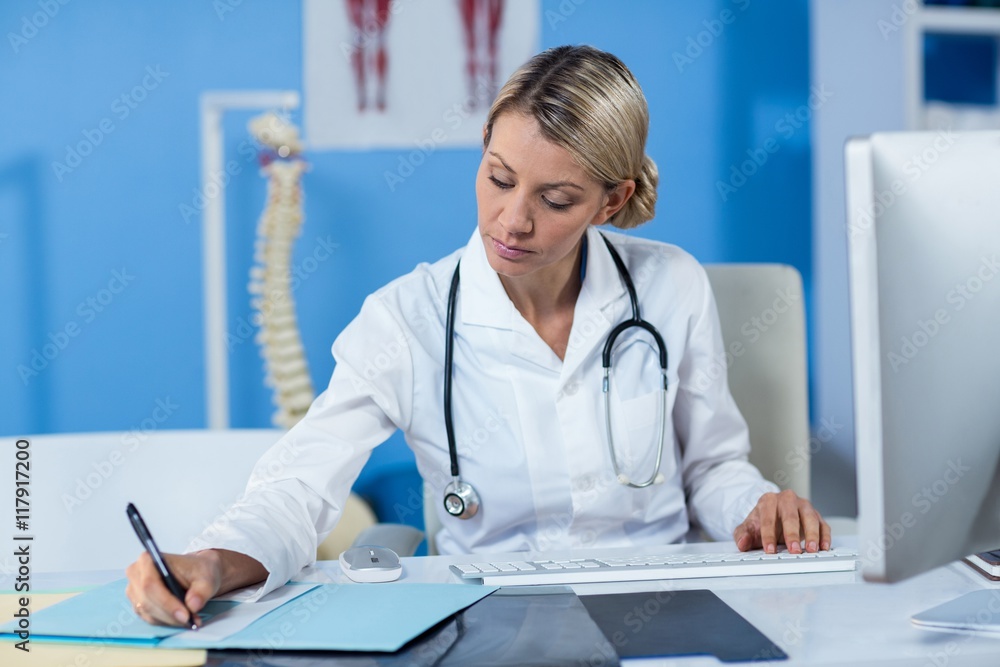 Physiotherapist writing a medical report Stock Photo | Adobe Stock