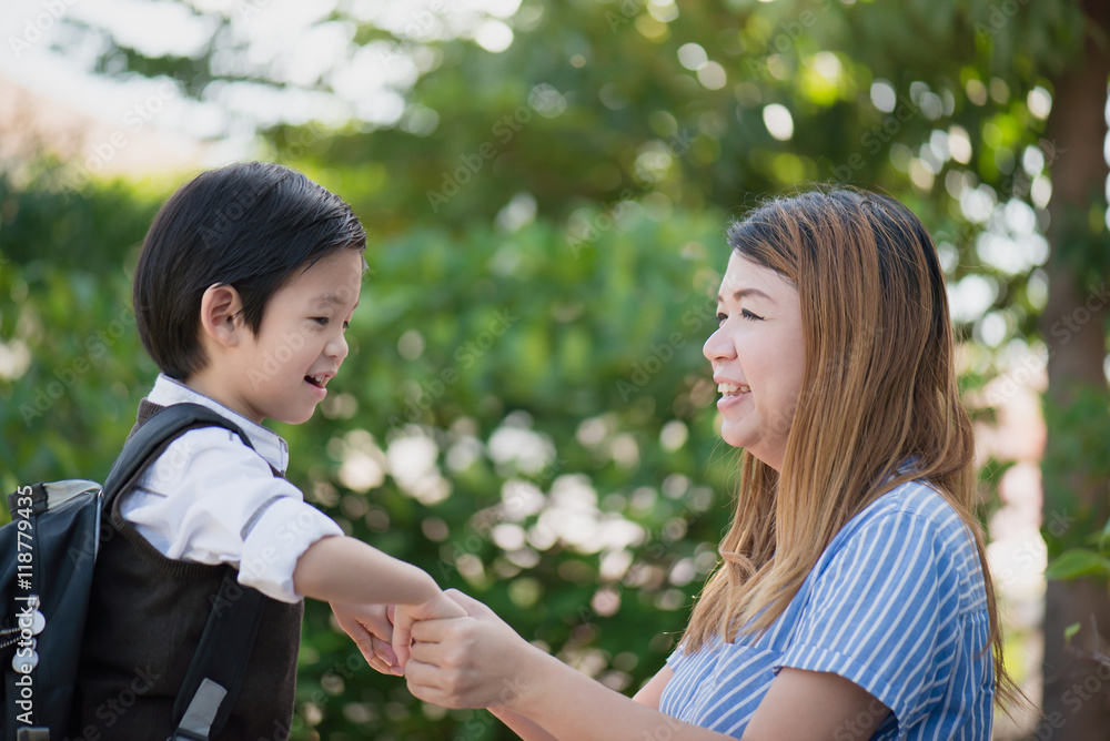 mother saying goodbye to her son as he leave for School Stock Photo ...