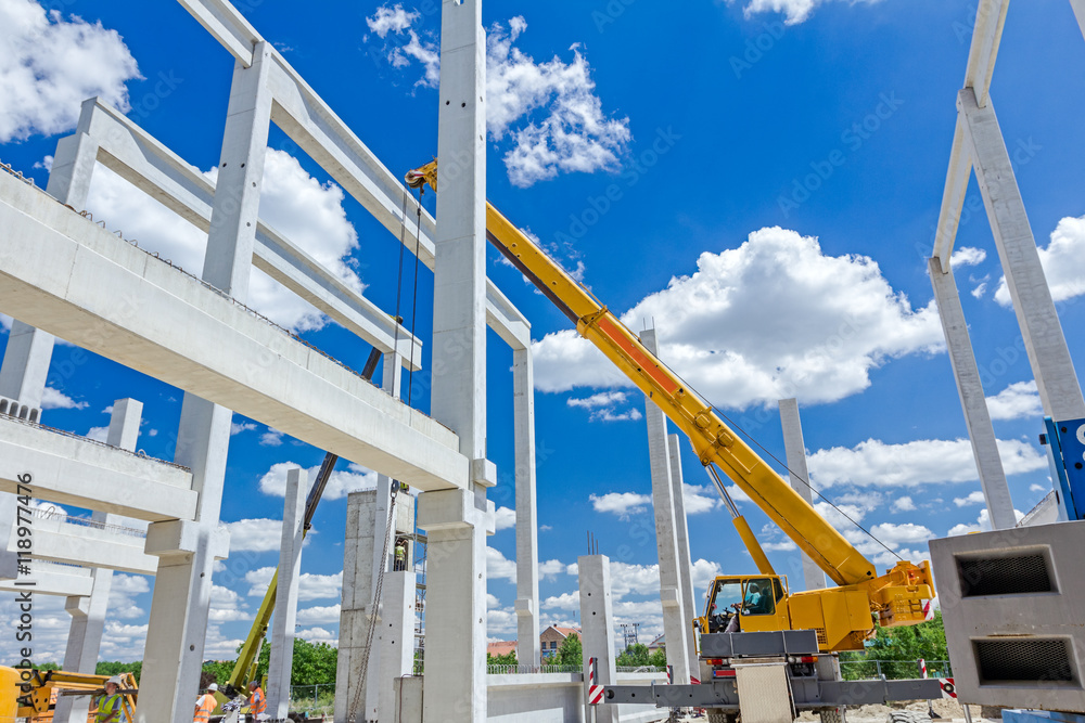 Mobile crane is assembly skeleton of huge hall Stock Photo | Adobe Stock